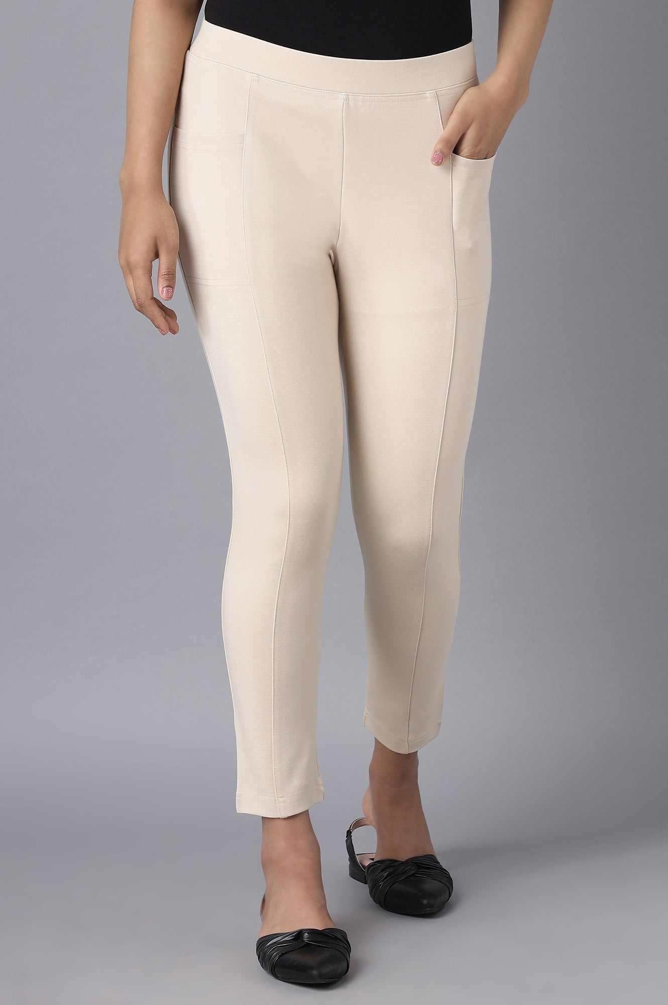 Buy Elleven Women's Beige Solid Straight Fit Pants With Elasticated ...